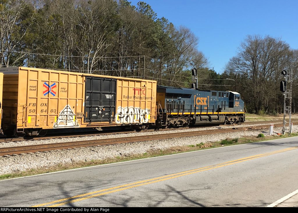 CSX 3049 gives a well-needed push at the tail end